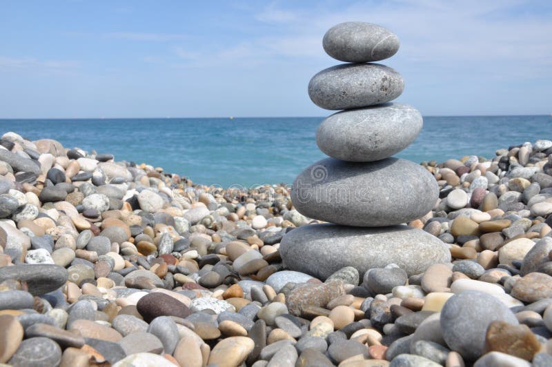 Stack of Pebbles on the Beach Stock Photo - Image of peak, abstract ...