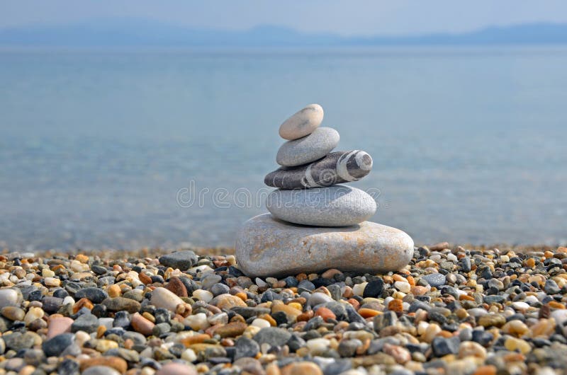 Stack of pebbles on beach stock image. Image of round - 86674189