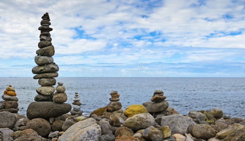 Stack of Pebbles on the Beach and Sea Background Stock Photo - Image of ...