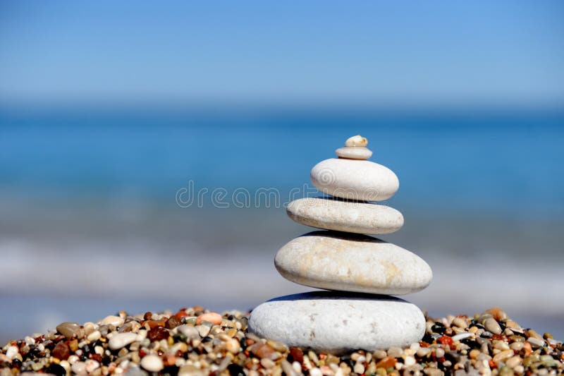 Stack of Pebbles on a Big Rock at the Beach Stock Image - Image of ...