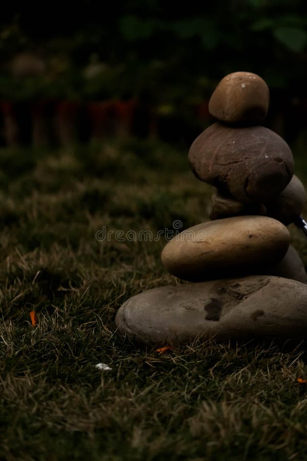 Stack of Pebbles on the Grass in the Garden at Night Stock Photo ...