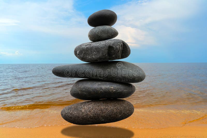 Stack of Pebbles in an Unstable State. Stock Photo - Image of coast ...