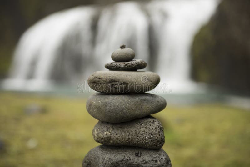 Stack of Pebbles and Waterfall Stock Photo - Image of group, nature ...