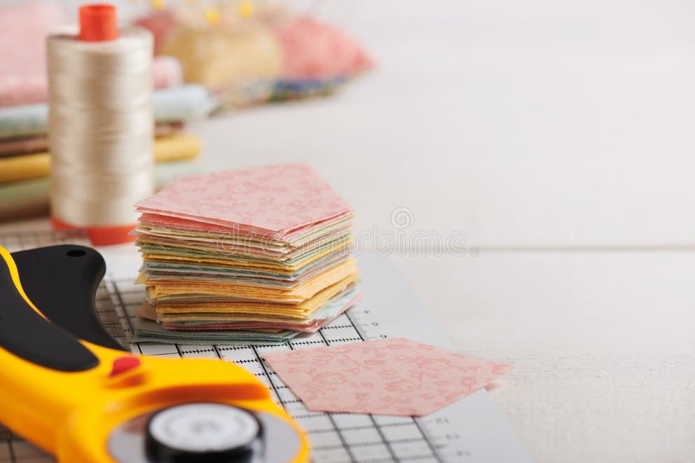 Stack of Pentagon Pieces of Fabrics on White Craft Mat, Sewing ...