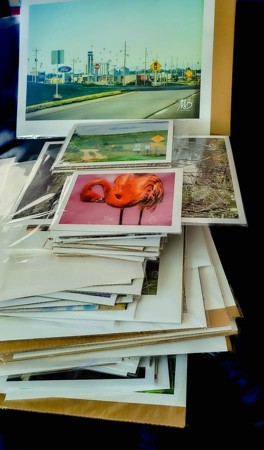 Stack of Photos with Images Being Removed, on Table Top Stock Image ...
