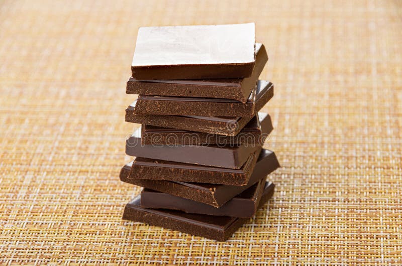 Stack of Pieces of Chocolate on Mat Stock Photo - Image of dark, piece ...