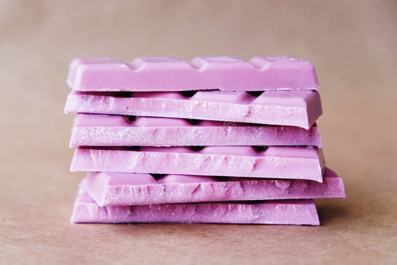 Stack of Pink Chocolate Bars on Light Brown Background Stock Image ...