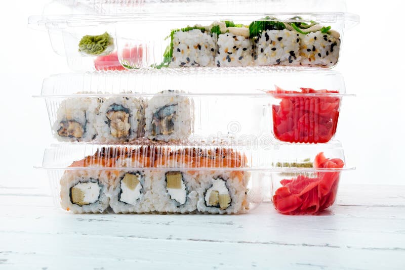 Stack of Plastic Boxes with Sushi Roll Sets and Paper Bag. Stock Image ...