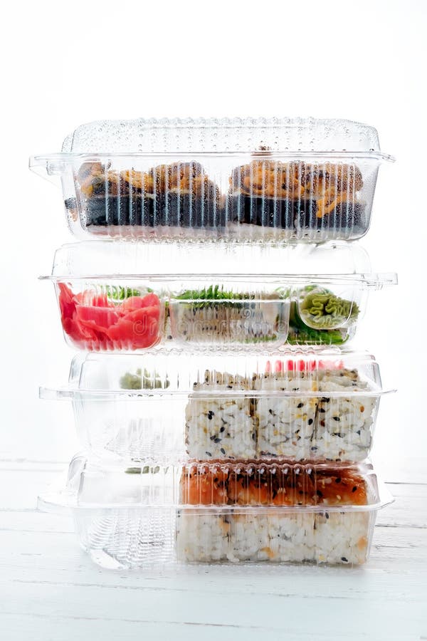 Stack of Plastic Boxes with Sushi Roll Sets. Food Delivery Stock Photo ...