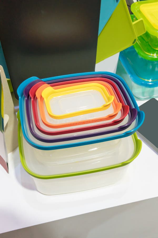 Stack of Plastic Containers with Different Sizes and Lid Colors Stock ...