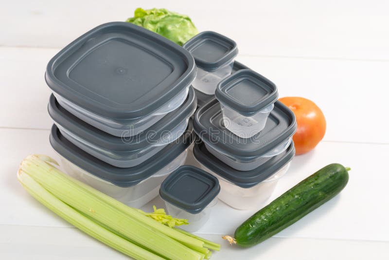 A Stack of Plastic Containers and Raw Vegetables on the Table. Storage ...