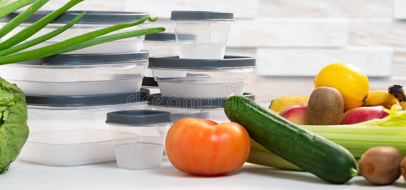 A Stack of Plastic Containers and Raw Vegetables on the Table. Storage ...