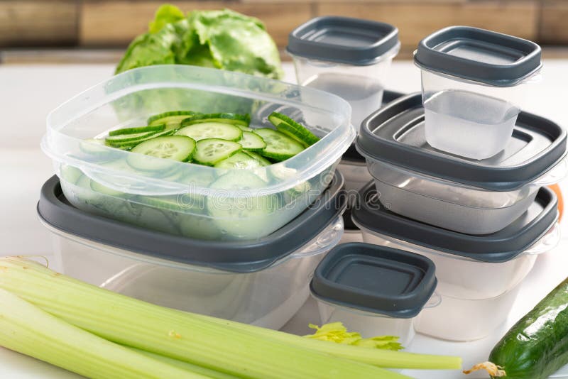 A Stack of Plastic Containers and Raw Vegetables on the Table. Storage ...