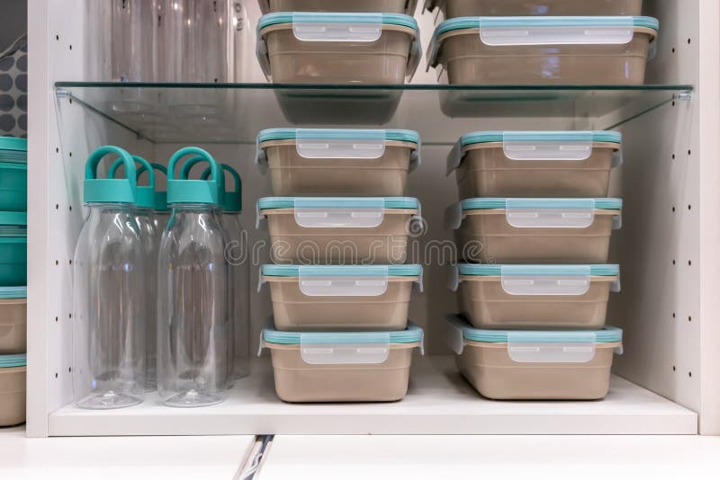 Stack of Plastic Food Containers and Black Clear Plastic Bottles Inside ...