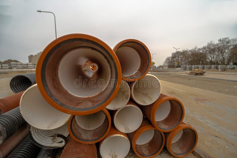 A Stack of Plastic Sewage Pipes Lying Picturesquely on a Road ...