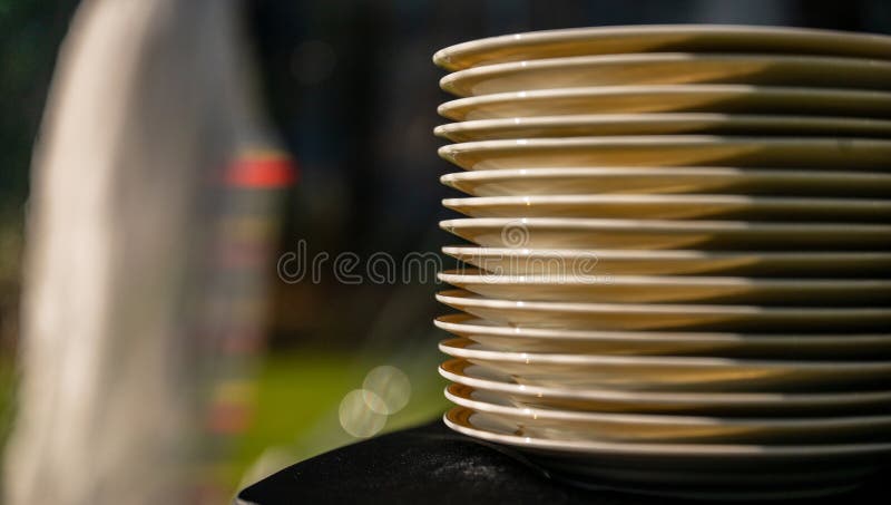 Stack of Plates before Dinner Starts Stock Photo - Image of silver ...