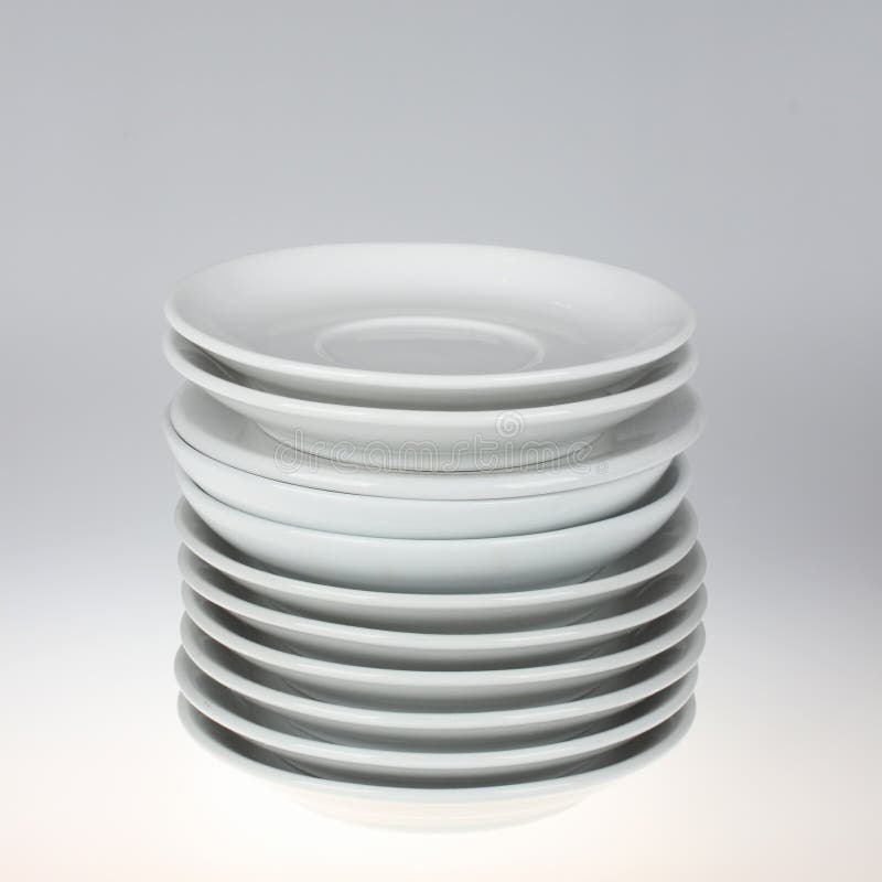 Stack of plates stock image. Image of pile, stacked, saucers - 66069011
