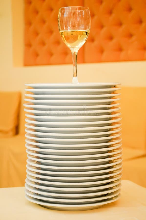 Stack of Plates with Wineglass Stock Image - Image of group, dishware ...