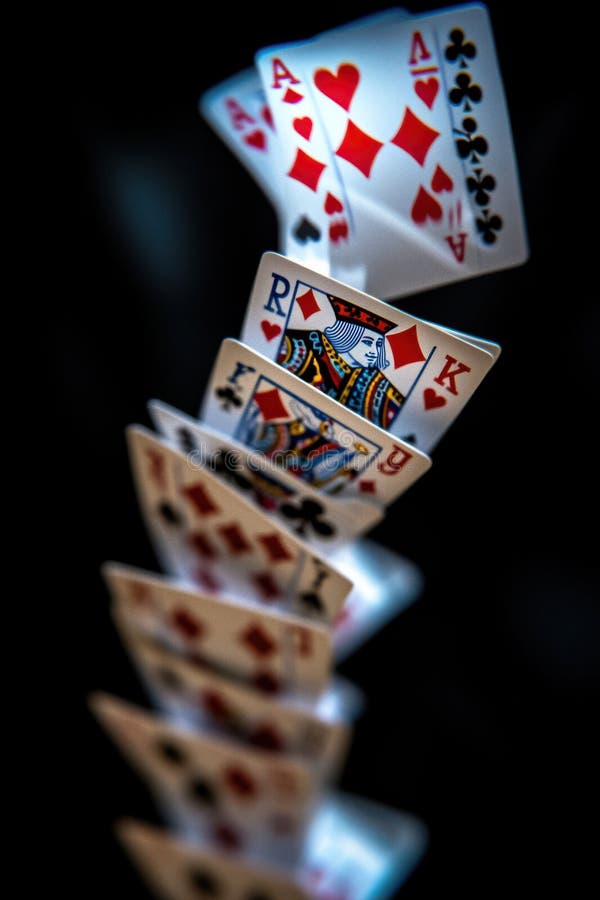 A Stack of Playing Cards with the Top Card Reading a Stock Image ...