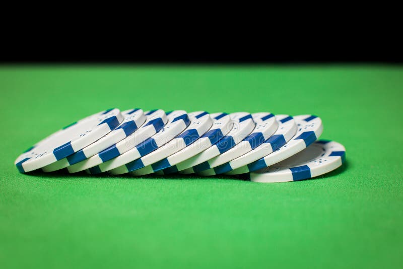 Stack of Poker Chips on a Green Table Stock Image - Image of ...