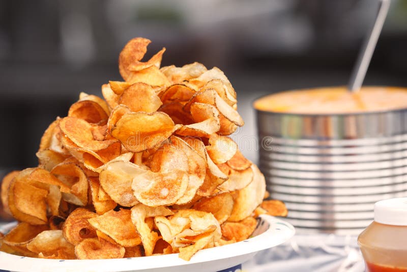 Stack of Potato Chips with Large Can of Sauce Stock Photo - Image of ...