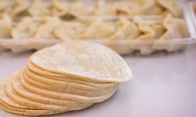 Stack of Raw Chinese Dumpling Skins with Flour. Stock Image - Image of ...