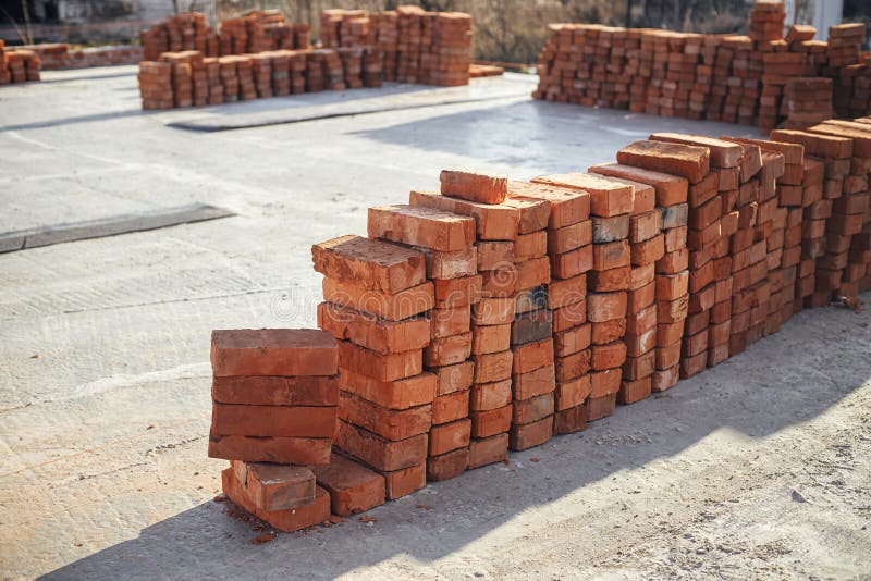 Stack of Red Bricks on Concrete Foundation, Process of House Building ...