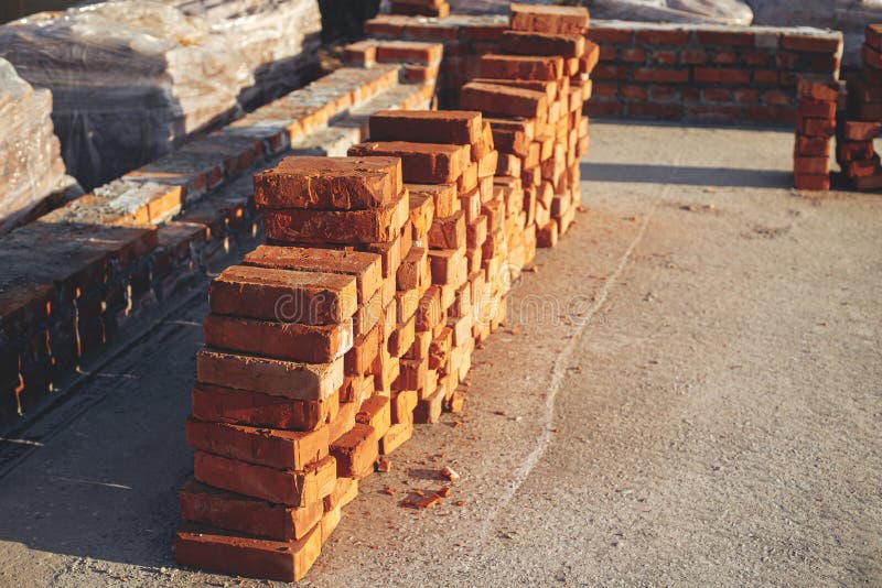 Stack of Red Bricks on Concrete Foundation, Process of House Building ...