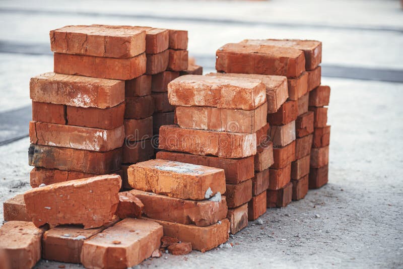 Stack of Red Bricks on Concrete Foundation, Process of House Building ...
