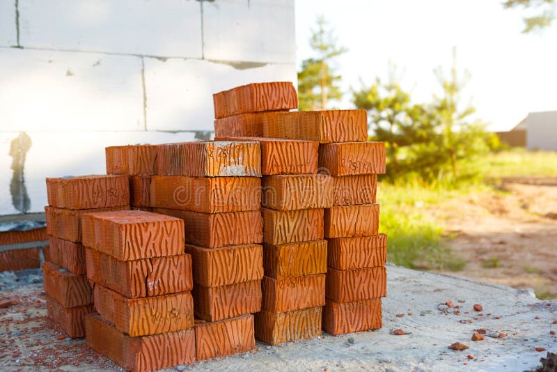 A Stack of Red Bricks at a Construction Site. Construction Materials ...
