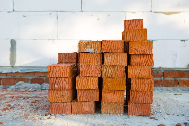 A Stack of Red Bricks at a Construction Site. Construction Materials ...