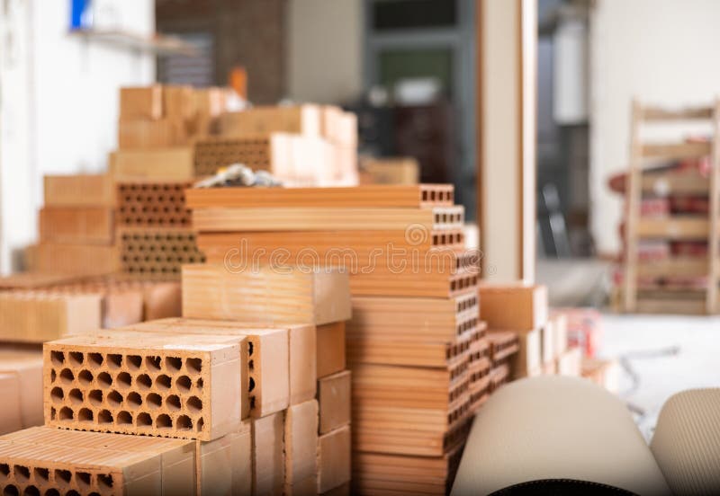 Stack of Red Bricks Inside Building Under Construction Stock Photo ...