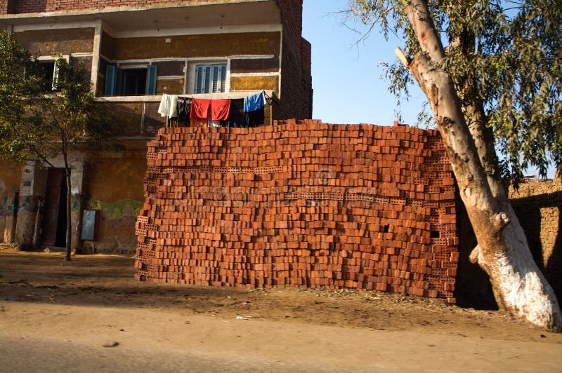 Stack of Red Bricks Outside Apartments in Cairo, Egypt Stock Photo ...