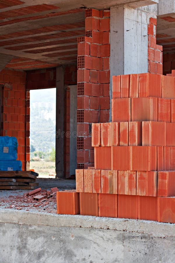 Stack of Red Building Blocks on Messy Site Stock Image - Image of ...