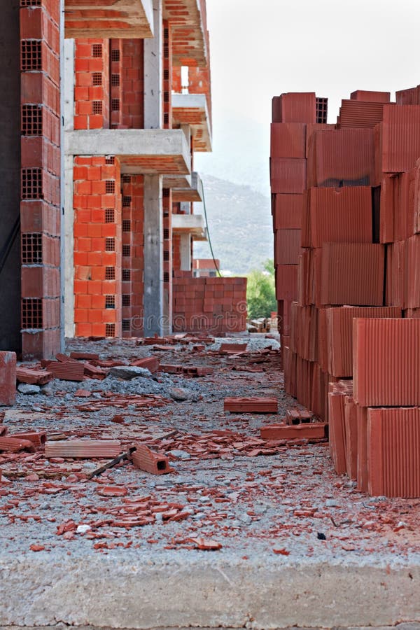Stack of Red Building Blocks on Messy Site Stock Photo - Image of ...