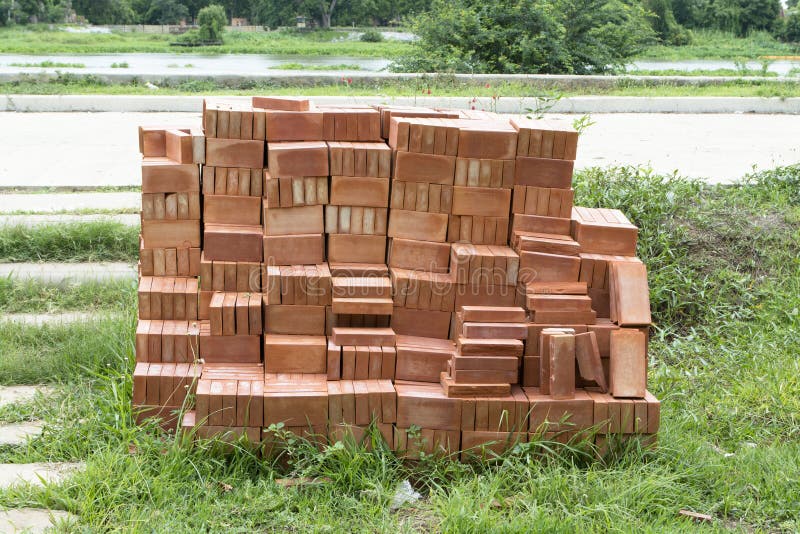 Stack of red clay brick stock image. Image of development - 96364057