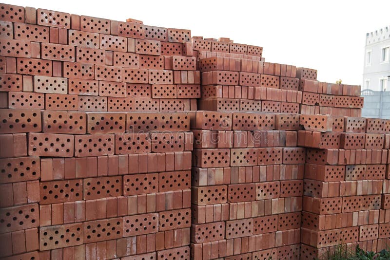 Stack of Red Clay Brick on Construction Site Stock Photo - Image of ...
