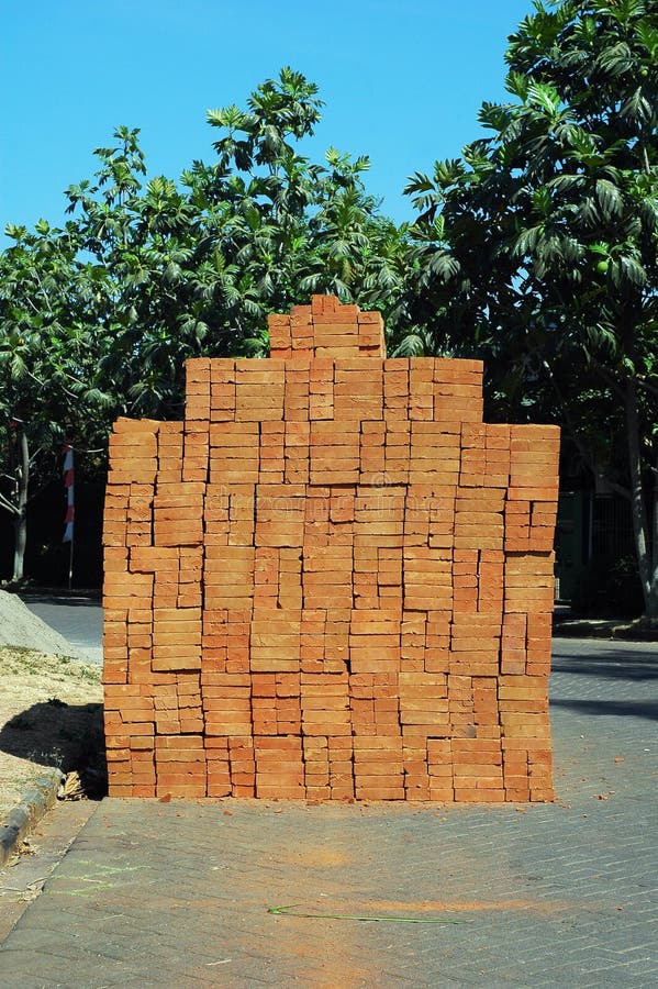 A stack of red clay bricks stock photo. Image of closeup - 26393174