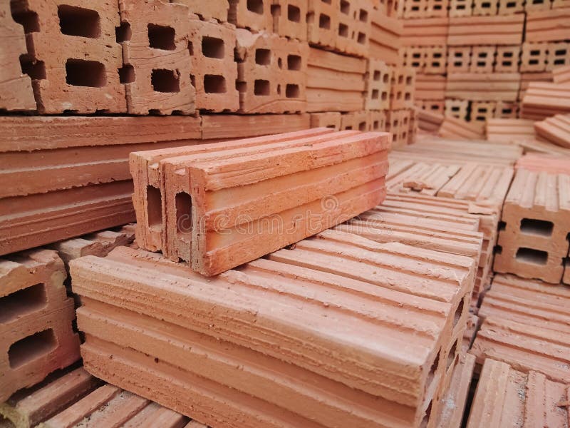 Stack of red clay bricks stock photo. Image of industrial - 63981320