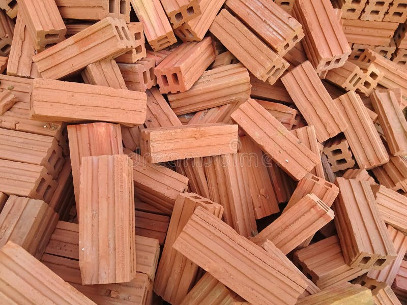 Stack of red clay bricks stock image. Image of heavy - 63981359
