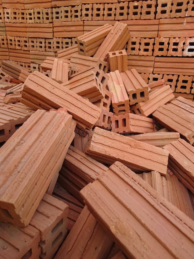 Stack of red clay bricks stock photo. Image of industrial - 63981320