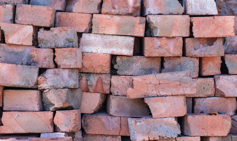 A Stack of Red Clay Bricks. Rows of Old Dirty Cracked Bricks ...