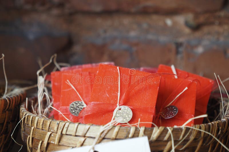 A Stack of Red Color Soaps with Ribbons in a Basket Stock Photo - Image ...