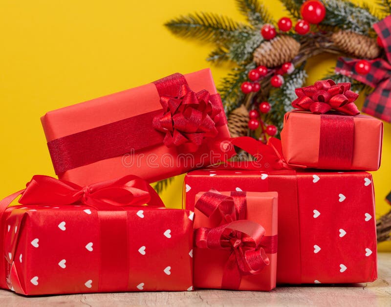 Stack of Red Gift Boxes on Yellow Background Stock Photo - Image of ...