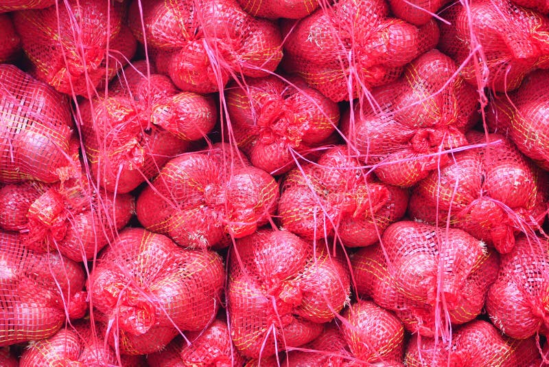 Stack of red onion in bags stock image. Image of ripe - 258140065