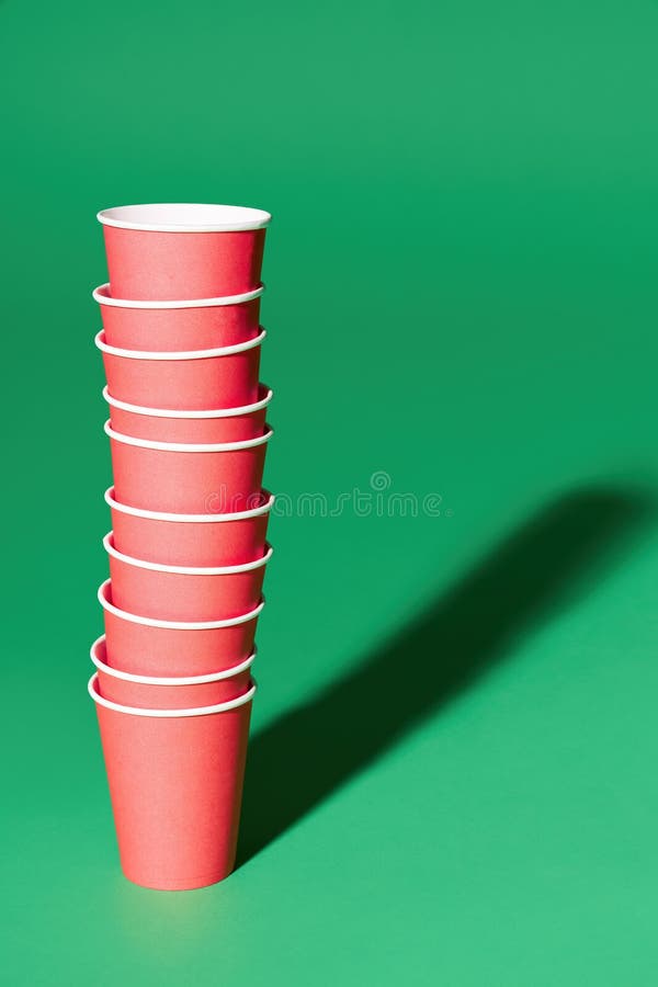 Stack of Red Paper Cup on Green Background Stock Image - Image of ...