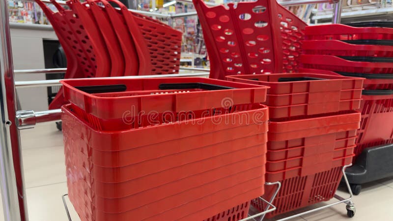 Stack of Red Plastic Baskets with Wheels Designed for Easy Mobility in ...