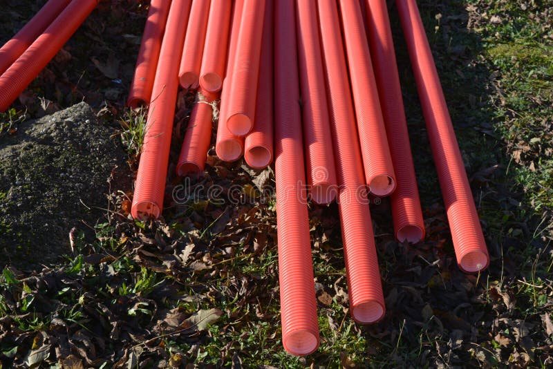 Stack Red Plastic Electricity Cable Protection Pipes Stock Photo ...