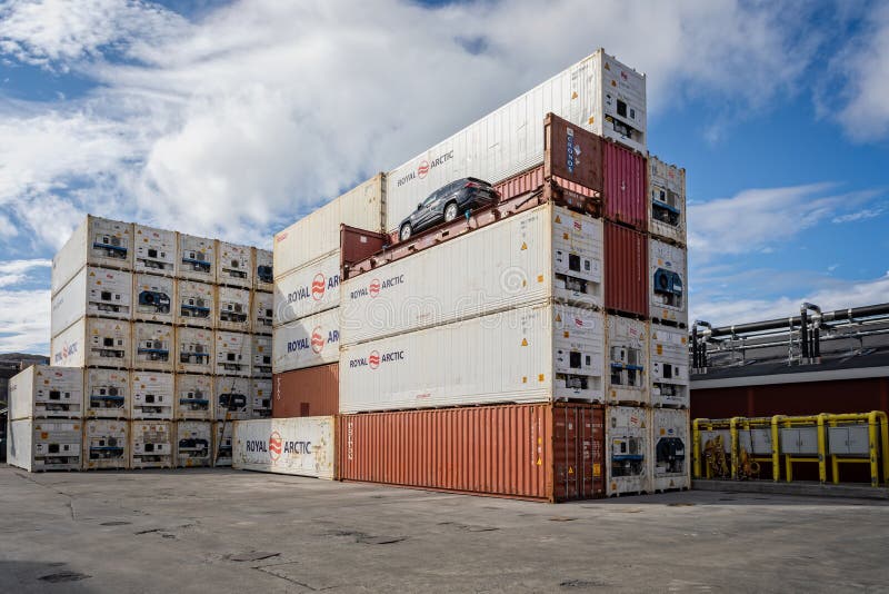 Stack of Red and White Containers with Black Car on Open Container on ...