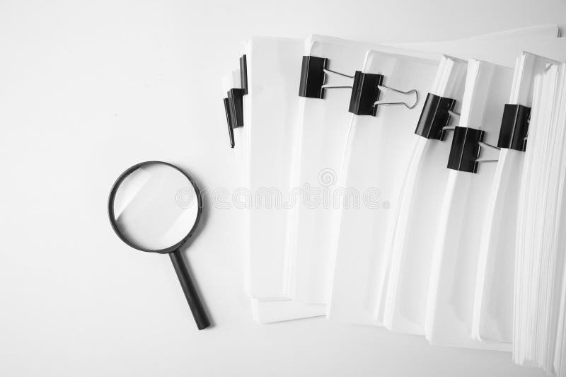 Stack of Report Paper Documents with Magnifying Glass Stock Image ...